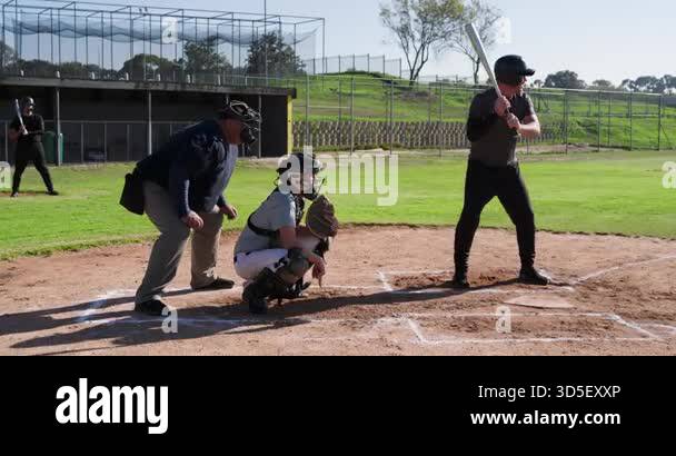 Catcher at plate catching ball with mitt after runner dashing 3rd ...