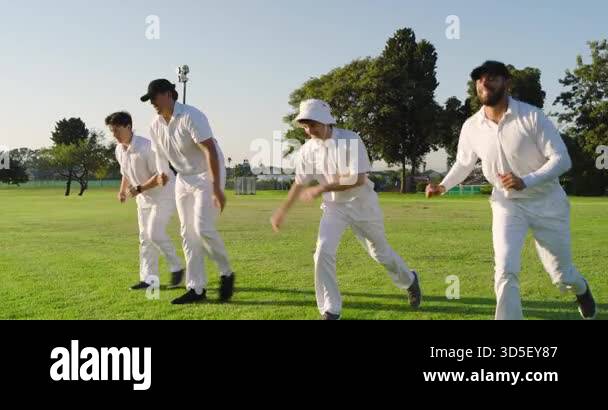Stepping onto field diverse men in white uniforms warming up with ...
