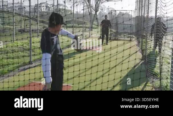 Coach and trainee bouncing ball tossing underhand and catching with ...