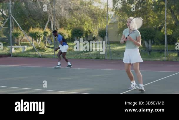 Diverse male and female opponents serving, backhanding, forehanding in ...