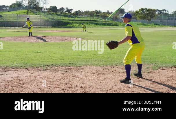 Adjusting grip on mound male baseball players pitching and tracking ...