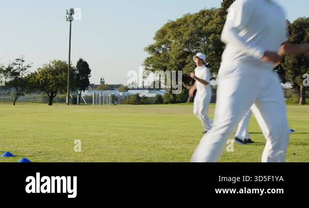 After cue, diverse male duo performing high-knee side steps around blue ...
