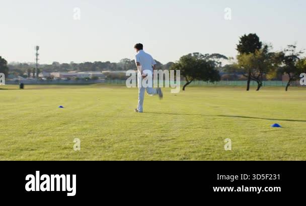 After player tapping blue cone, male cricketers sprinting, leaping ...