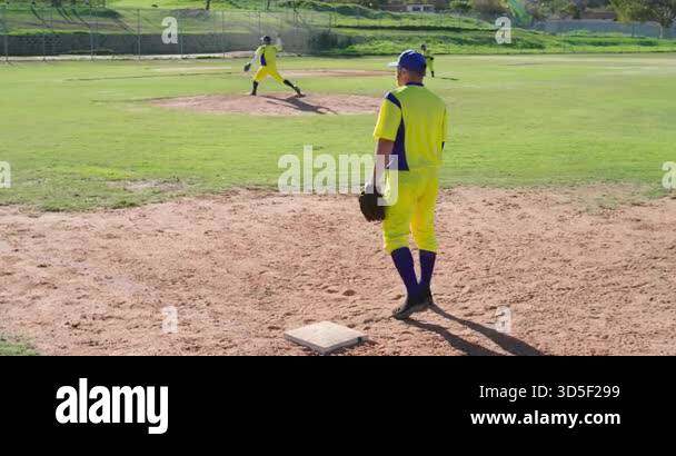 Pitcher fielding grounder throwing to White male first baseman catching ...