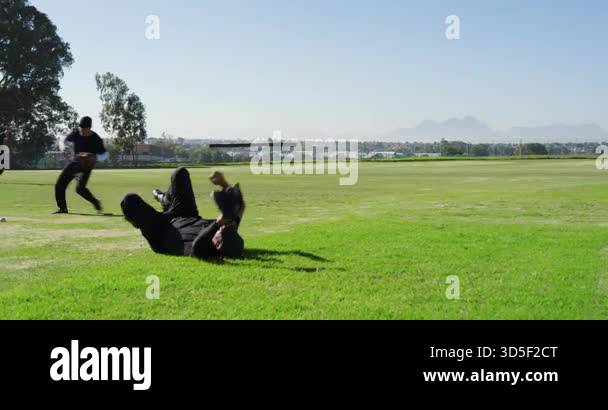 Baseball being thrown, white male fielders sprinting, leaping, securing ...