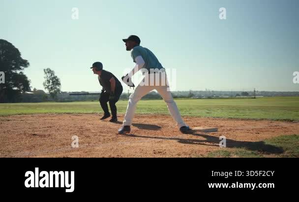 White male first baseman catching pickoff and tagging Hispanic runner ...