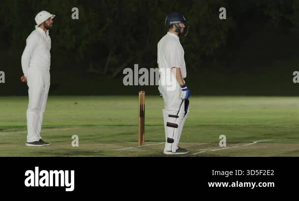 Jogging bowler delivering ball seeking wicket to Indian batsman missing ...