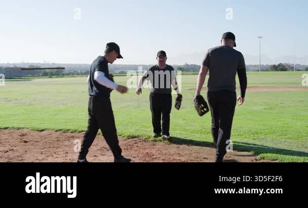 After glove checks and baseball tosses, male teammates practicing catch ...