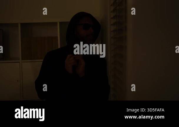 Criminal man do thief crime. Crime theft. Burglar man hold guy and hide ...