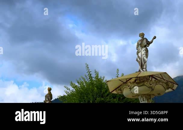 Female statue outdoors near the old style buildings. Low angle view at ...