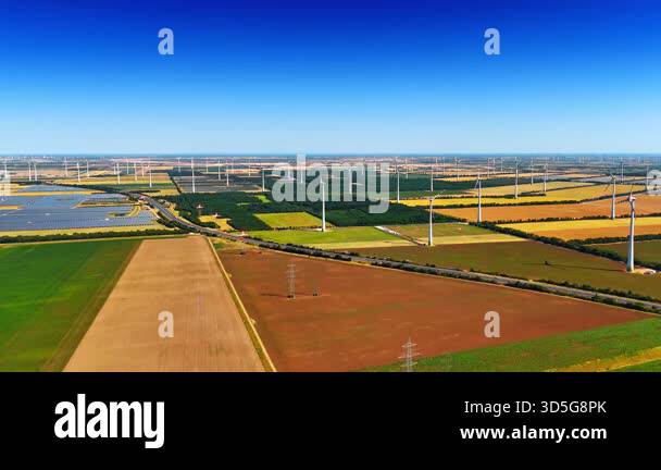 Energy production concept. Wind farms, electricity power lines and ...