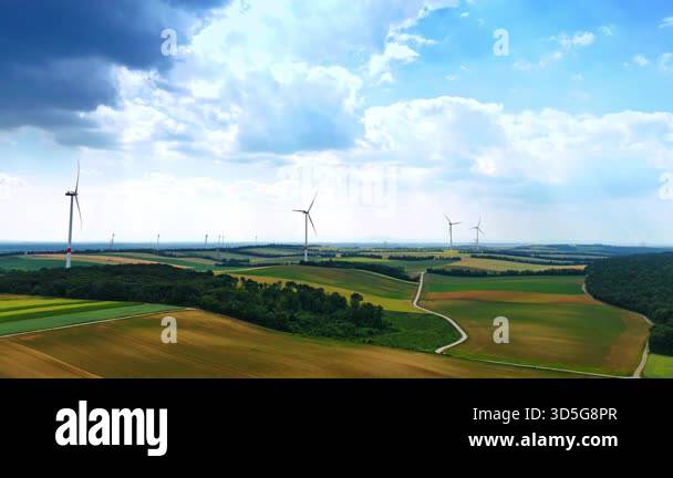 Large clouds gathered in the sky over the vast agricultural fields ...