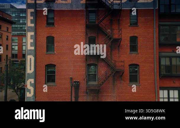 Denver, USA, 28 July 2025: Faade of the multi-storied red brick ...