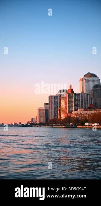 Golden hour light colors the facades of the buildings in New York ...
