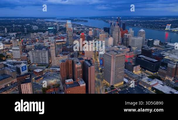 Flight over the scenery of Detroit at dusk time. View on the cityscape ...