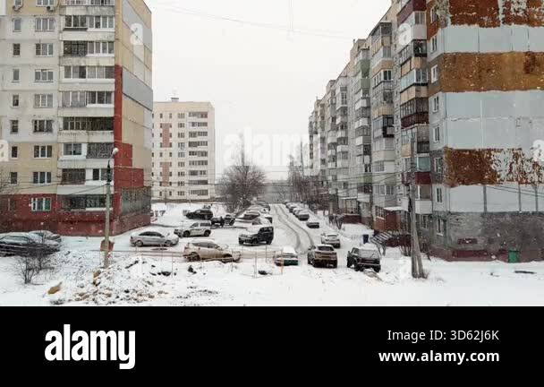Urban high-rise apartment buildings in Russia covered in snow during ...