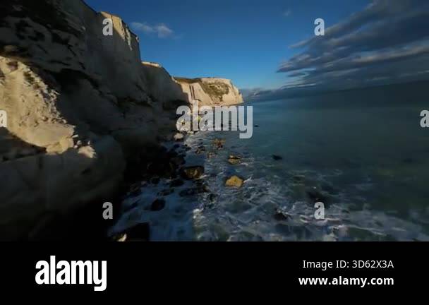 Coastline and seascape at Dover, White limestone cliffs at golden hour ...