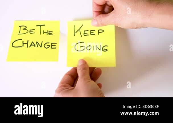 Video of three yellow sticky notes on a desk, each with a different ...