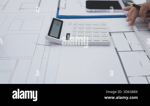 architect working on project, architectural plans, blueprints ...