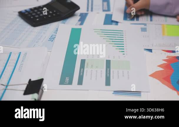 businessman using calculator to calculate data on office desk Stock ...