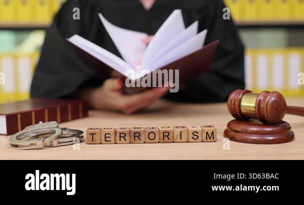 A figure in a black robe holds a large book, symbolizing law and ...