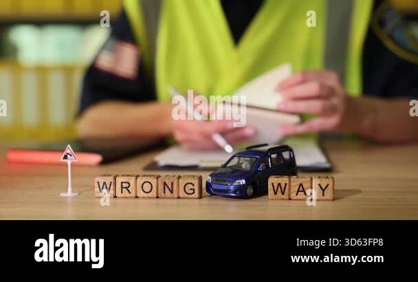 A traffic officer explains the dangers of wrong way driving using toy ...