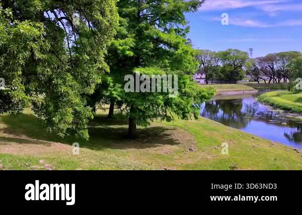 A leftward panning video of Parque Prado on a sunny spring afternoon ...