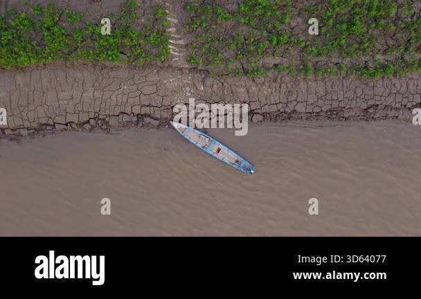 Scenic aerial perspective of a remote village with dirt roads nestled ...