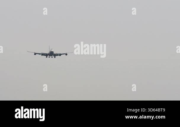 Large cargo aircraft on final approach, front view long shot, set ...