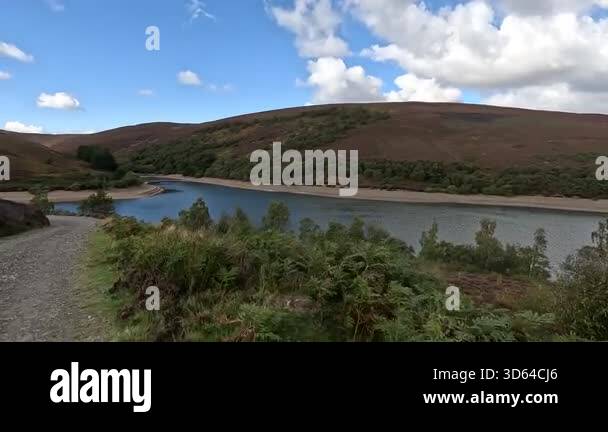 Hillwalker traversing upland moorland paths in the Lammermuir Hills of ...