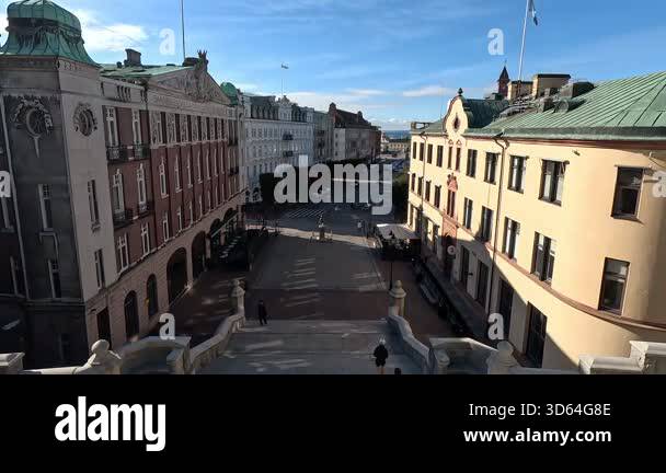 Glass and concrete facades of recent urban developments line the ...