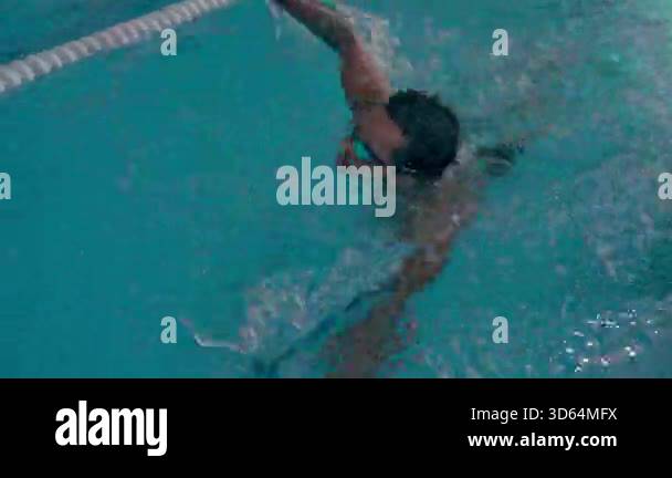 Swimmer Practicing Freestyle Stroke in Clean Indoor Swimming Pool. Professional Swim Techniques ...