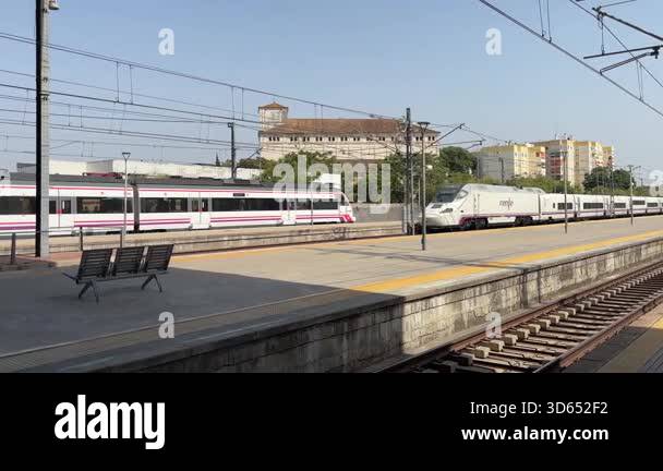 Spanish passenger trains operate across the southern landscape, linking ...