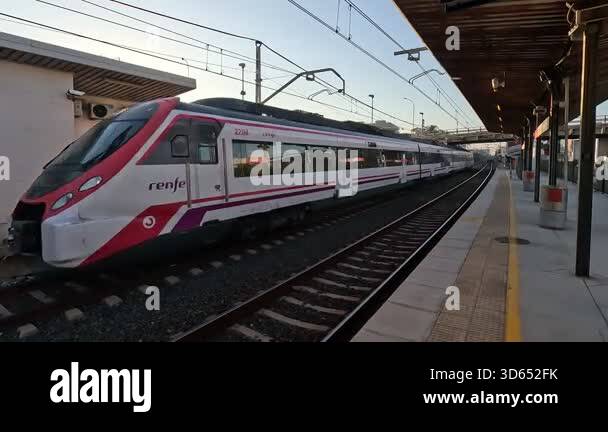 Spanish passenger trains operate across the southern landscape, linking ...