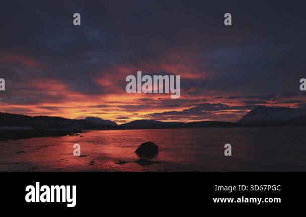 Timelapse captures a vivid Arctic sunset beyond the Arctic Circle in ...