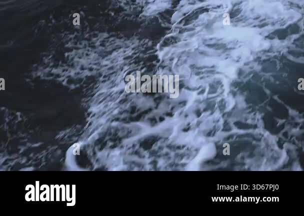 Waves splash from a moving boat on the Atlantic Ocean off Northern ...