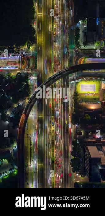 Aerial timelapse of Jakarta, Indonesia at night showing glowing ...