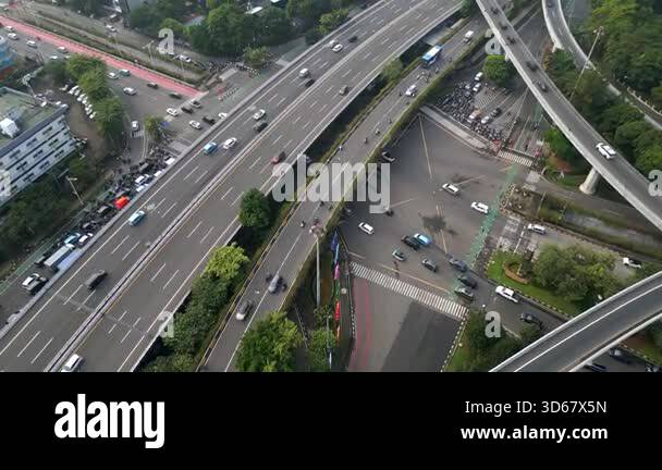 Aerial view of highway interchange with traffic in Jakarta, Indonesia ...