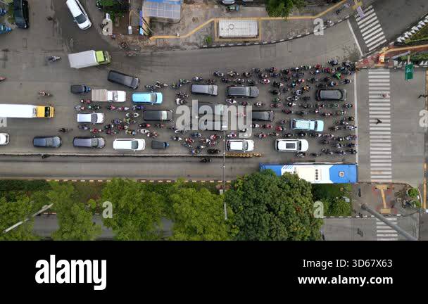Aerial top-down view of traffic jam with cars and motorbikes in Jakarta ...
