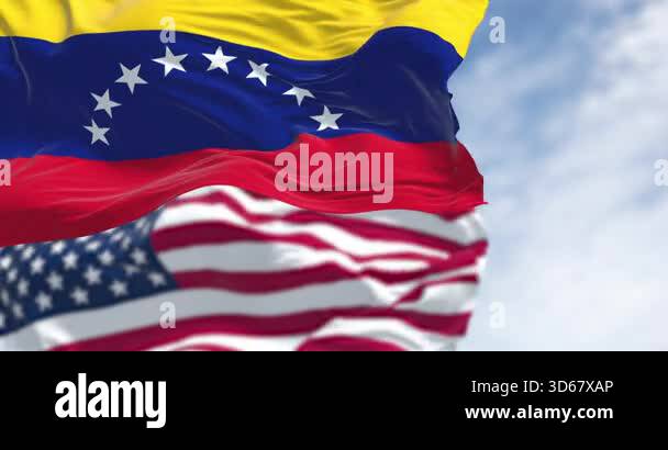 Venezuela and US national flags waving in the wind on a clear day ...