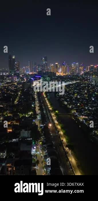 Aerial timelapse of Jakarta, Indonesia at night with illuminated ...