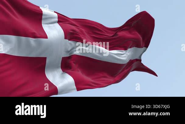 Close-up of Denmark national flag waving on a clear day. Red flag with ...