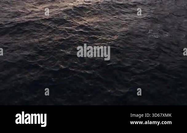 Aerial view of dusky ocean surface with shimmering highlights, Sunset ...