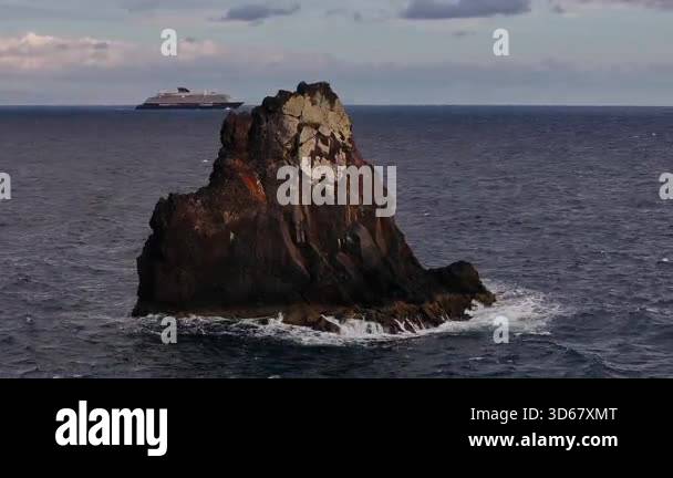 Rugged coastal formation, Cinematic shot capturing rough sea stacks ...