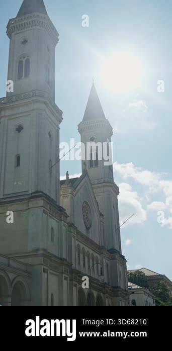 sunshine illuminates historic spires, urban church monument captured ...