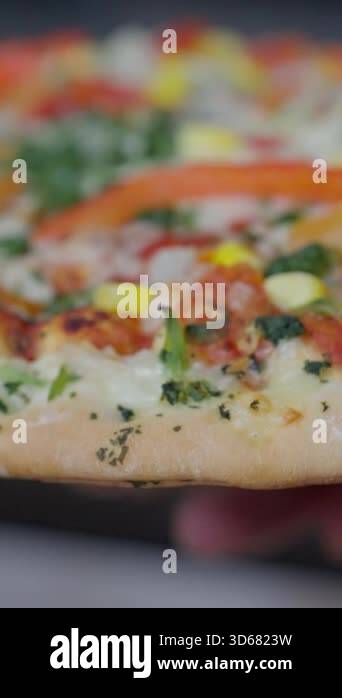 Closeup a delightful veggie pizza generously topped with an array of ...
