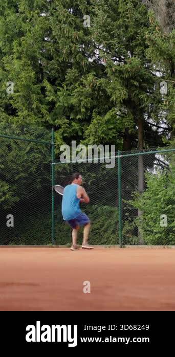 player smashing forehand on clay, male athlete executing forehand ...