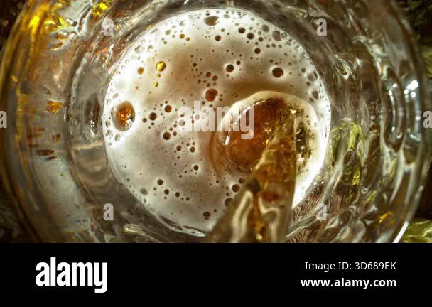 Super Slow Motion Detail Shot of Pouring Beer Inside Glass at 1000fps ...