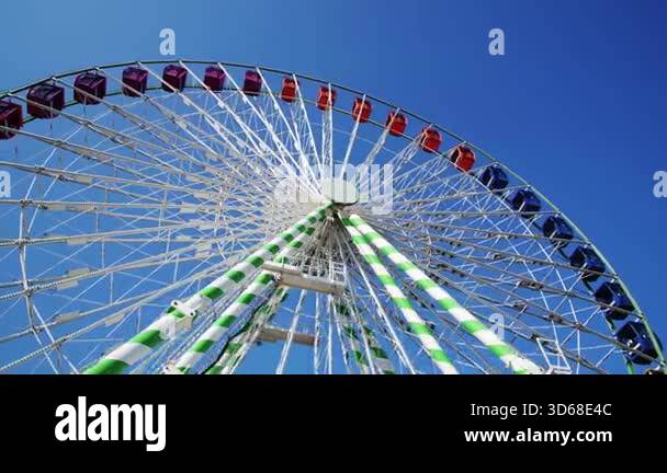Falcon Heights, Minnesota. State fair. Colorful Ferris wheel spinning ...