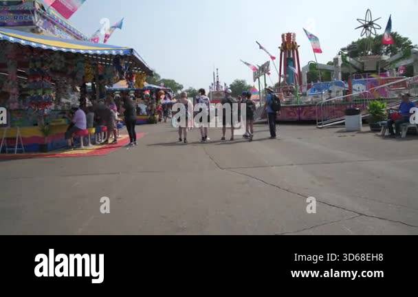 Falcon Heights, Minnesota. Minnesota state fair. People walking along ...